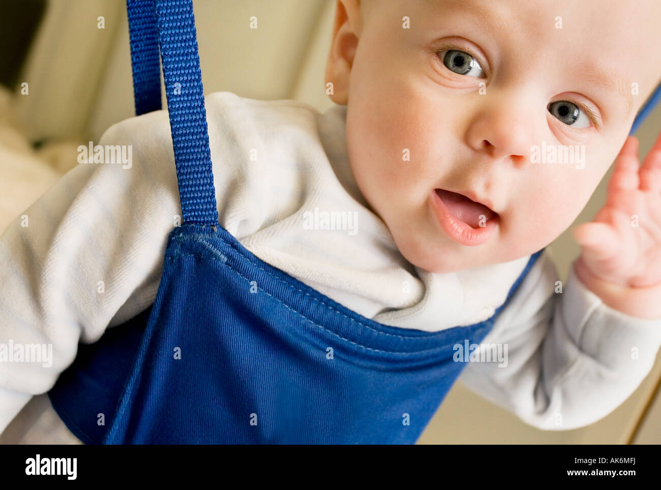 Baby in a hanging apparatus Stock Photo - Alamy