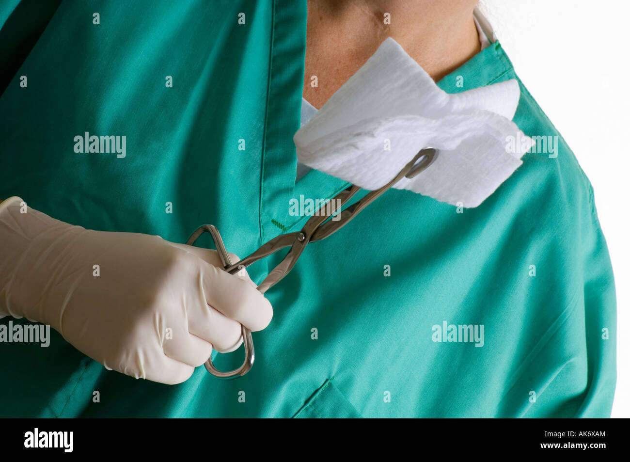 operating surgeon holding a bandage with clamps during surgery Stock ...