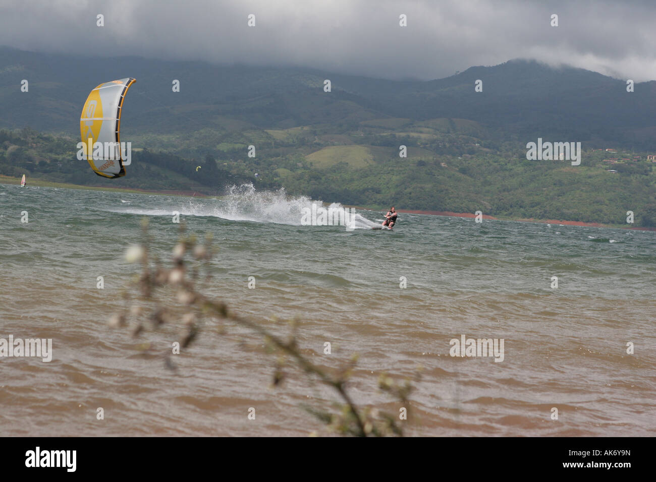 kite boarding in costa rica lake arenal Stock Photo - Alamy