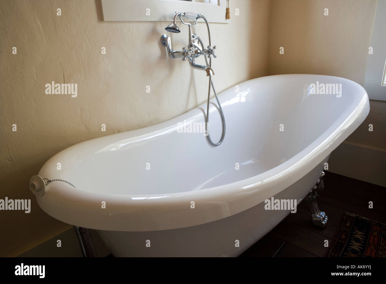 Spanish Style Claw Foot Tub and Chrome Faucet Stock Photo - Alamy