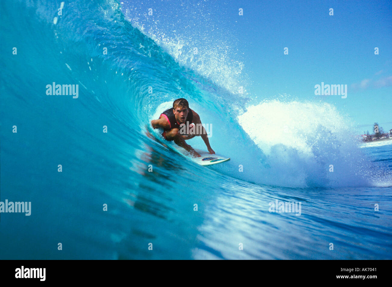 Surfer in the curl of a wave Stock Photo - Alamy
