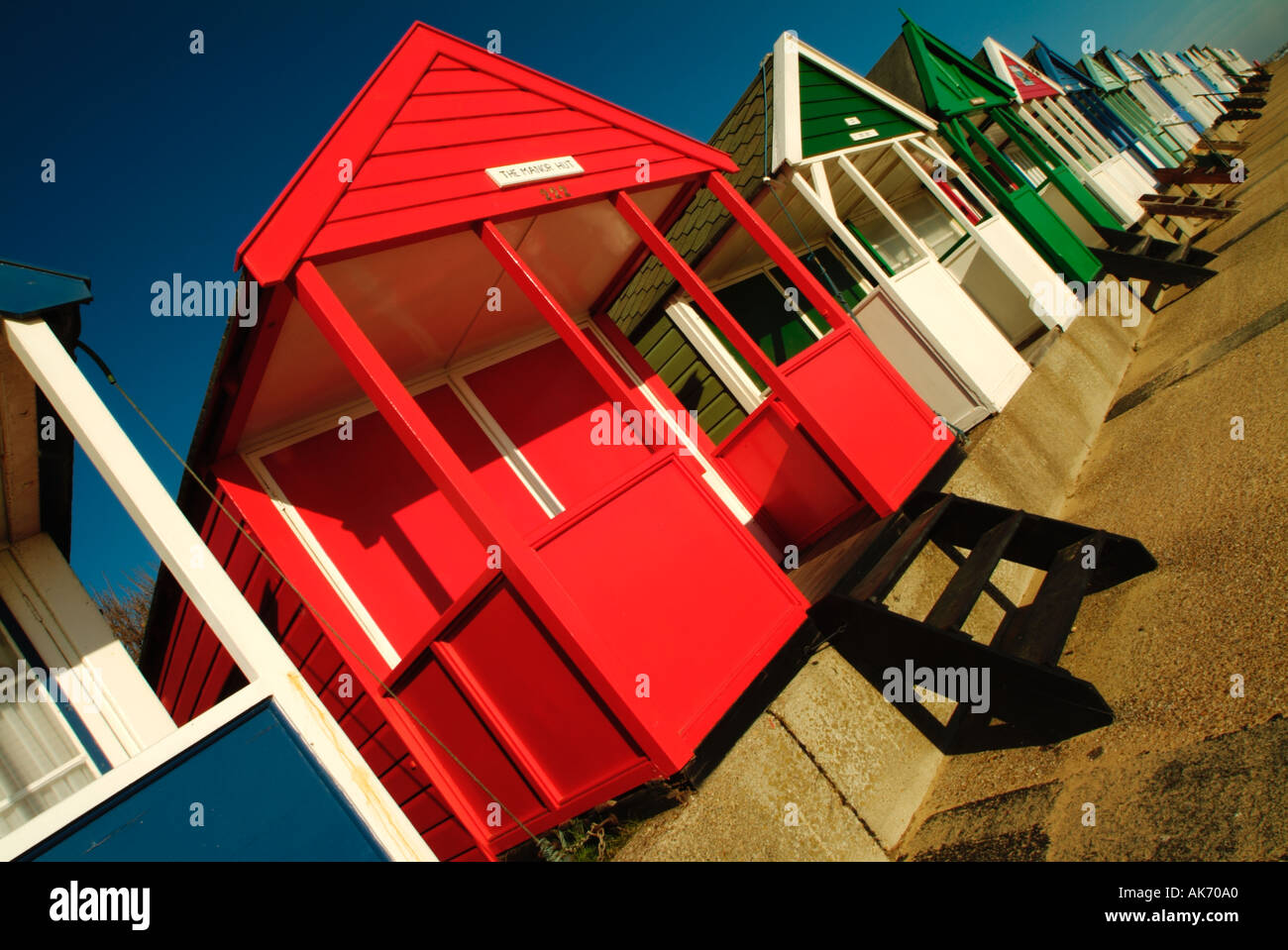 Brightly-painted beach huts Stock Photo - Alamy