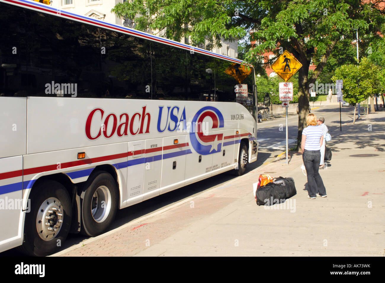 Bus picking up students leaving the University of Wisconsin Madison ...