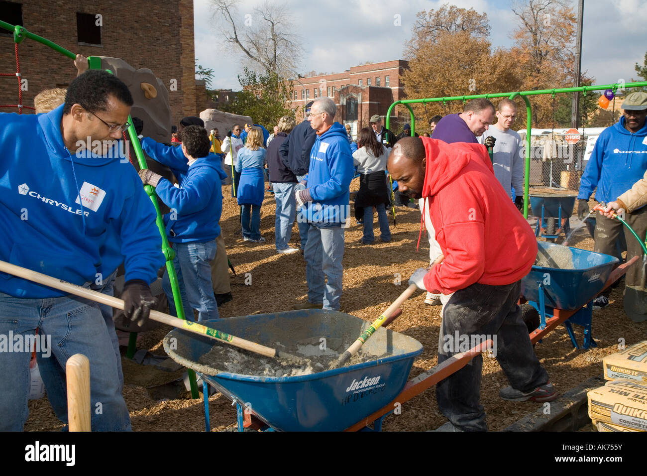 Volunteers build a playground for children in a low-income community ...