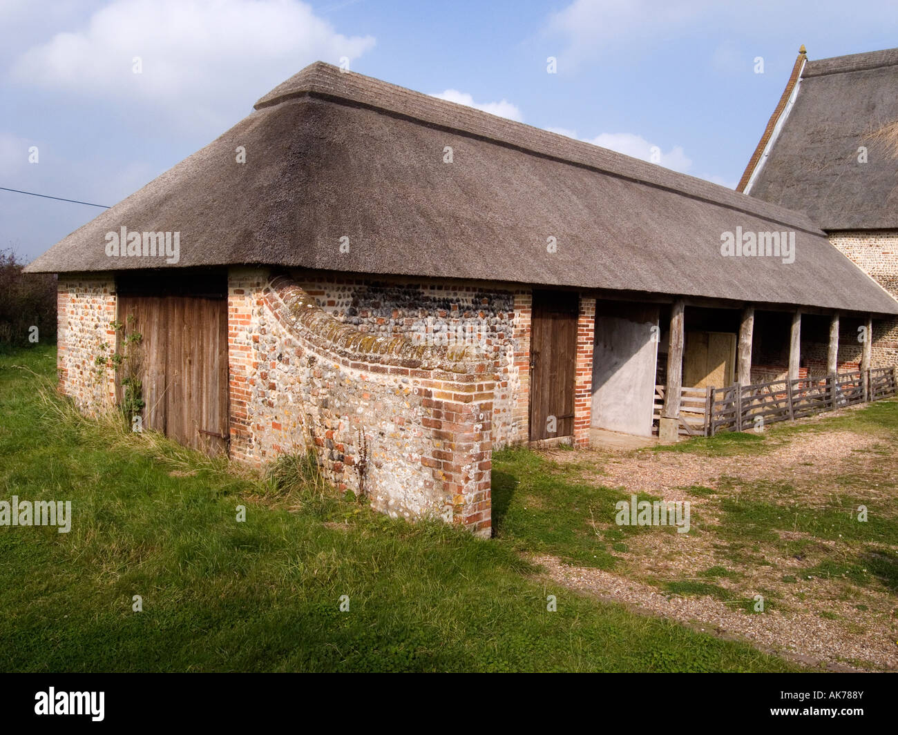 Traditional East Anglian farm building with brick and flint walls and ...