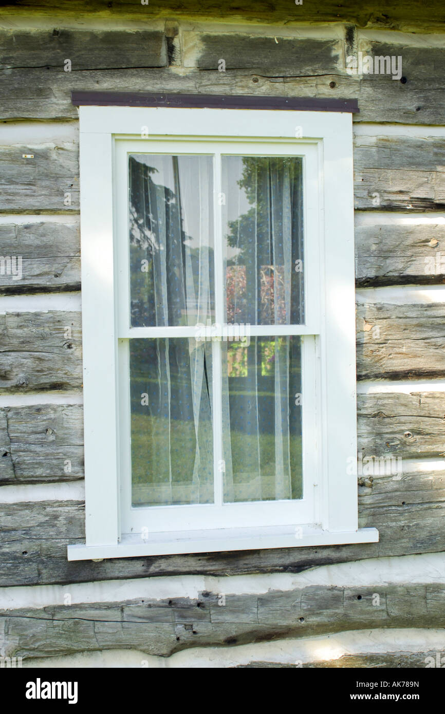 Four pane window in a traditional American Canadian log cabin Stock ...