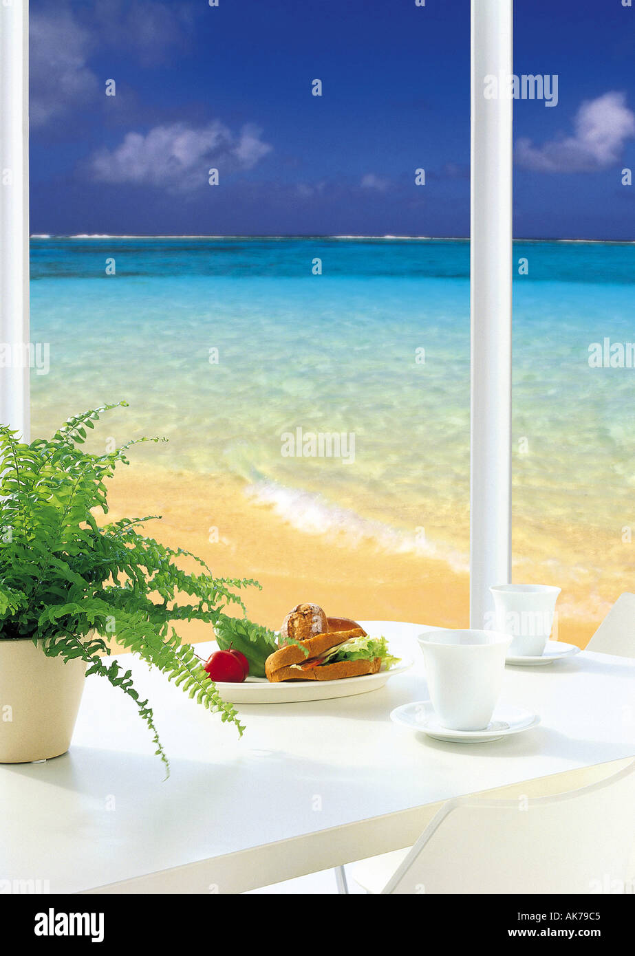 Dining table by the ocean Stock Photo - Alamy
