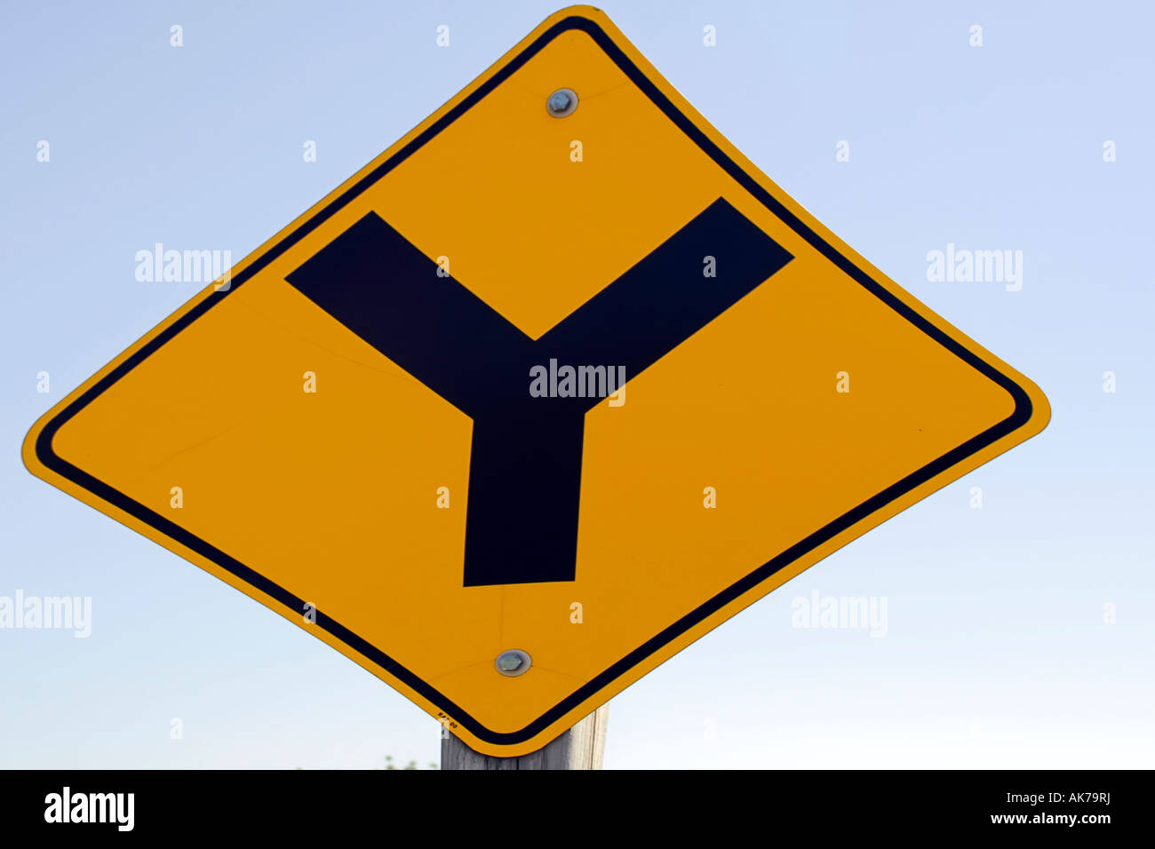 Y Road sign black Y on a yellow background Stock Photo - Alamy