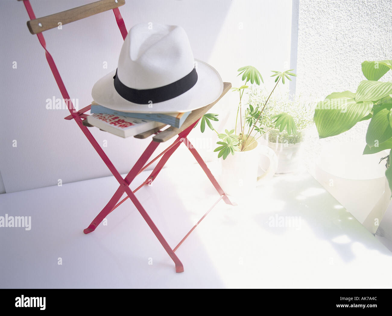 Hat on chair Stock Photo - Alamy