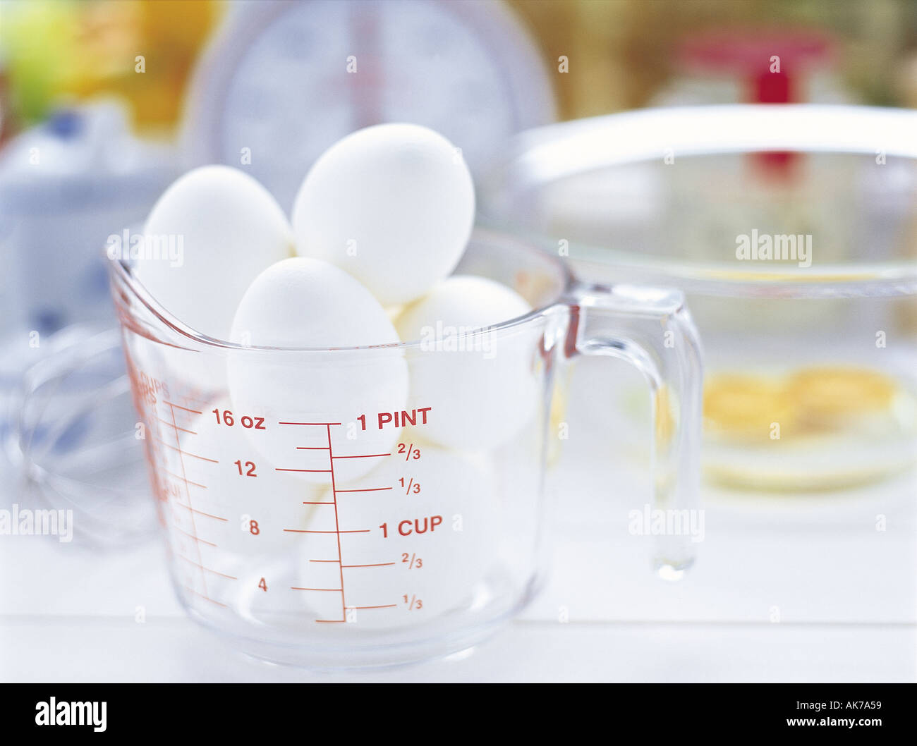 Eggs in measuring cup Stock Photo - Alamy