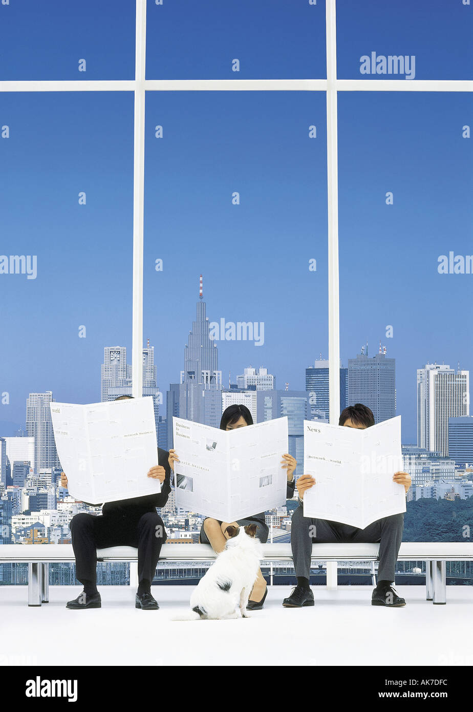 Business people reading newspaper Stock Photo - Alamy