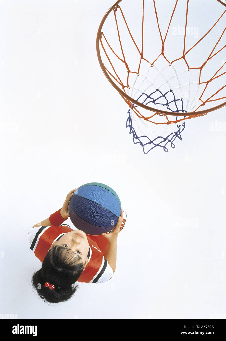 Girl shooting basketball Stock Photo - Alamy