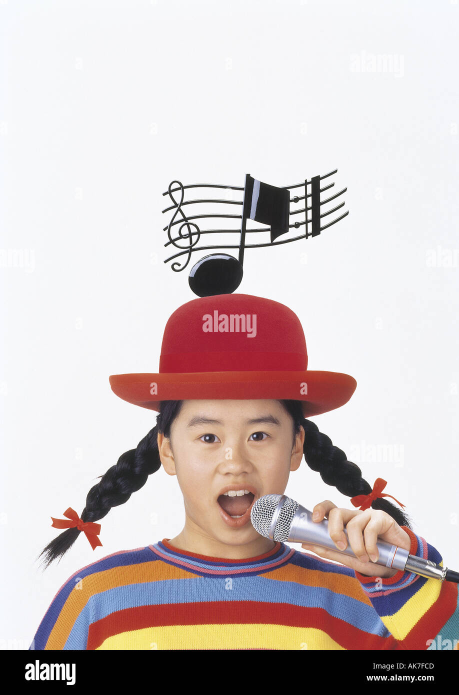 Girl with hat musical note Stock Photo - Alamy
