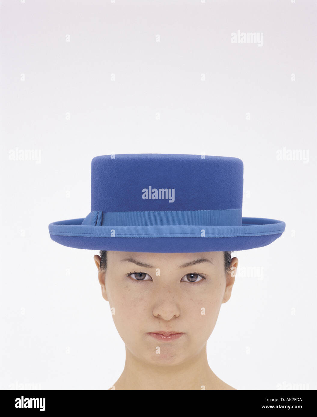 Woman with hat angry Stock Photo - Alamy