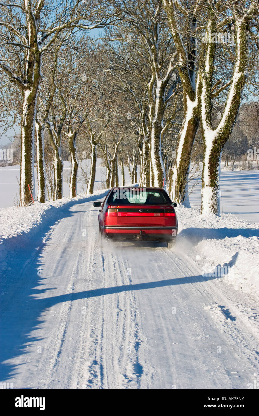 Car on a winter road Stock Photo - Alamy