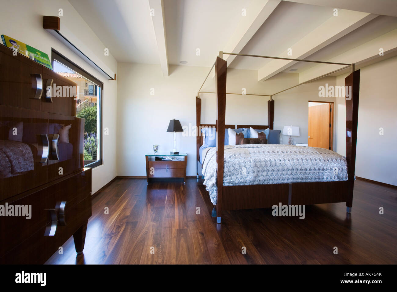 Minimalist Modern Bedroom with Four Post Bed Stock Photo - Alamy