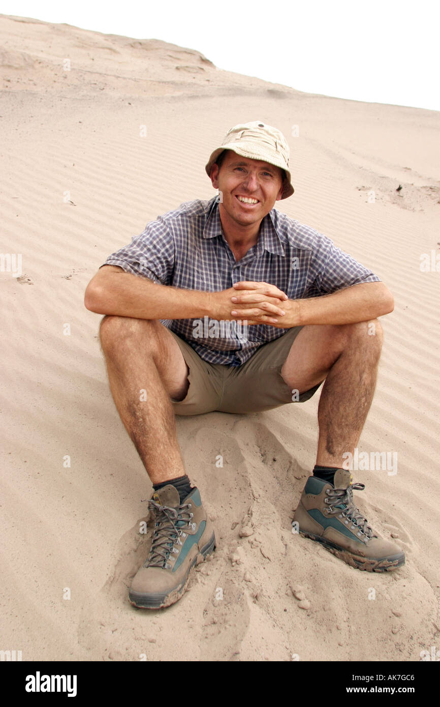 MR men sits in sand Stock Photo - Alamy