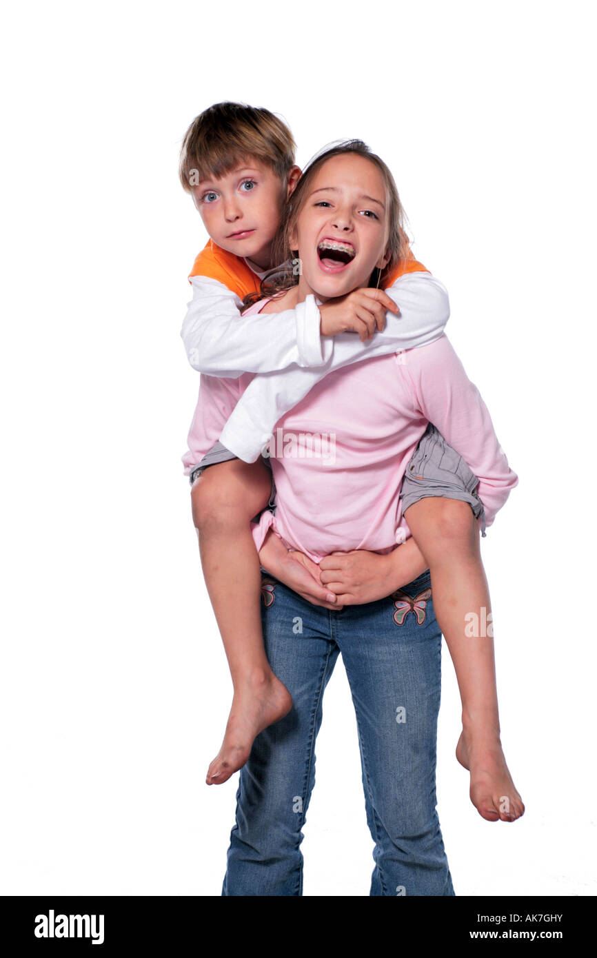 Photo of a Sister giving her Brother a Piggy Back Ride Stock Photo - Alamy