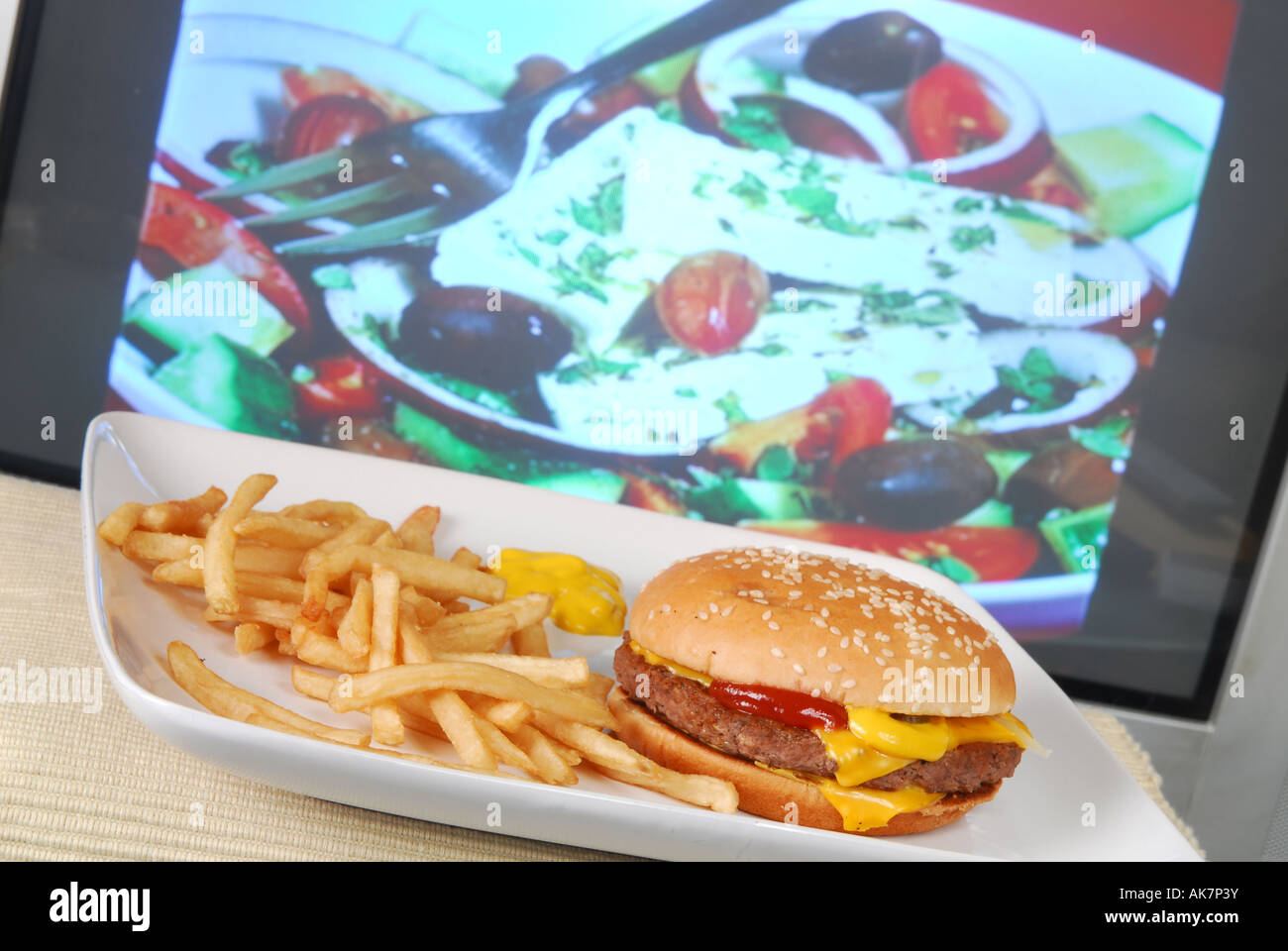 Concept shot to show unhealthy fast food TV dinner in front of ...
