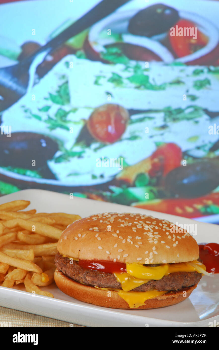 Concept shot to show unhealthy fast food TV dinner in front of ...