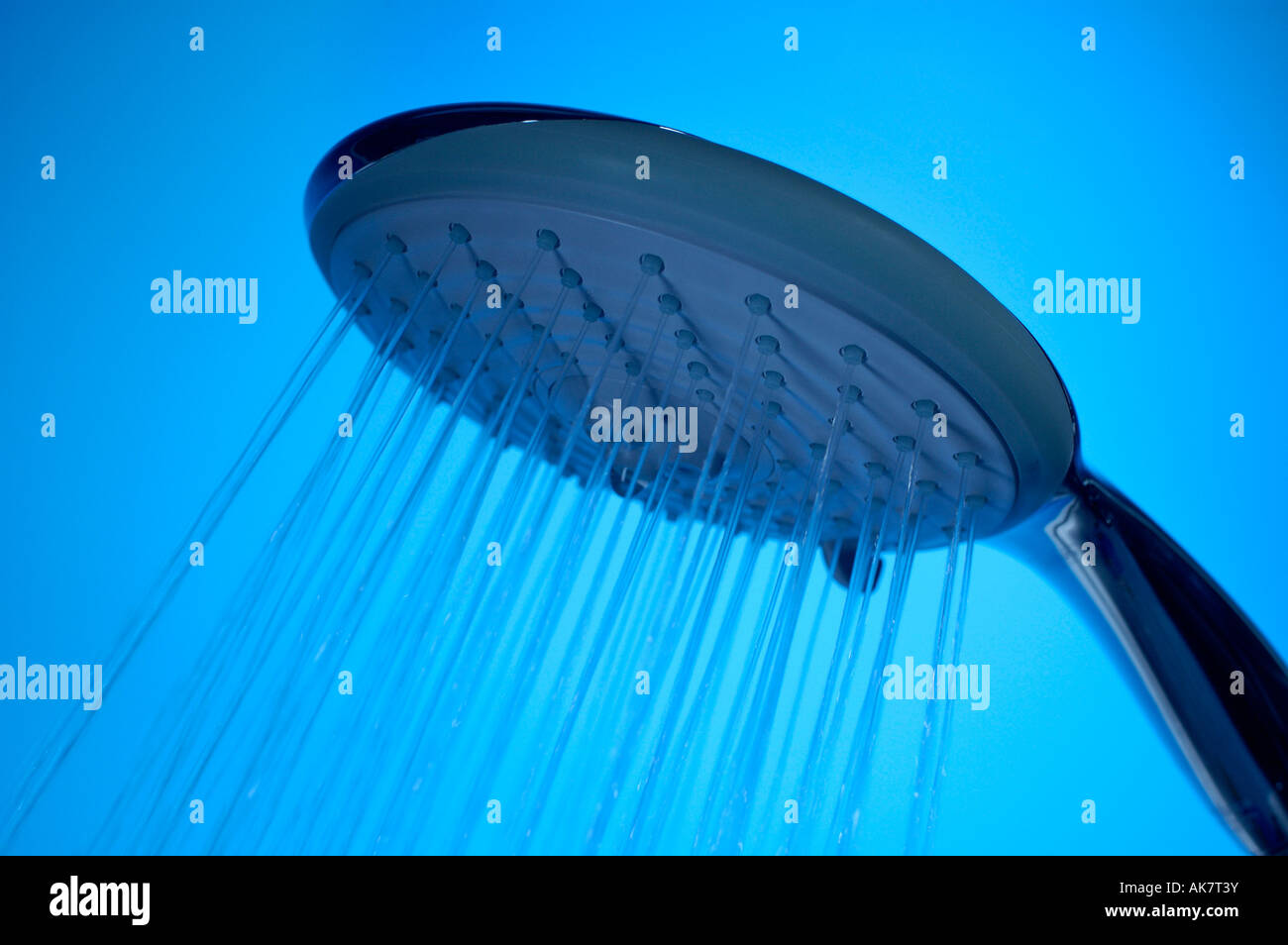 SHOWER HEAD WATER SPRAYING OUT OF IN BATHROOM Stock Photo - Alamy