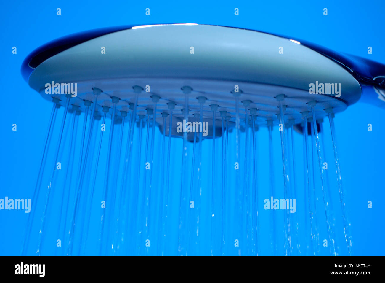 SHOWER HEAD WATER SPRAYING OUT OF IN BATHROOM Stock Photo - Alamy