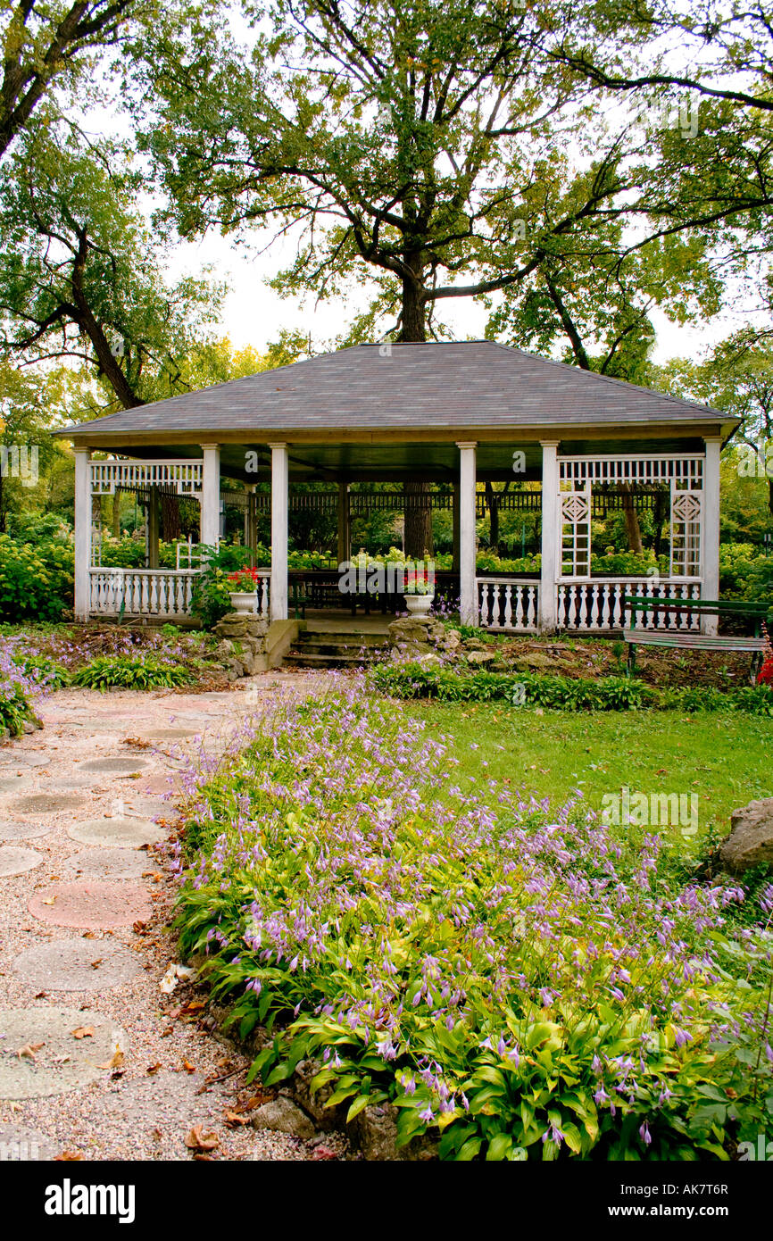 path with flowers toward a pavilion used for meditation at a religious ...