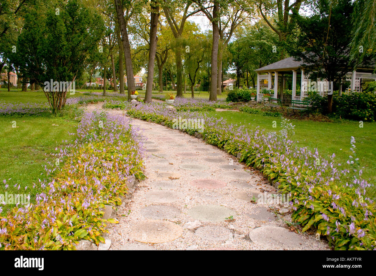 stone path in a garden toward a pavilion used for meditation at a ...