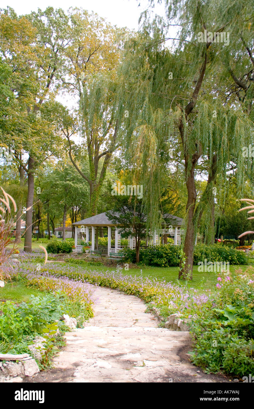 path with weeping willows toward a pavilion used for meditation at a ...