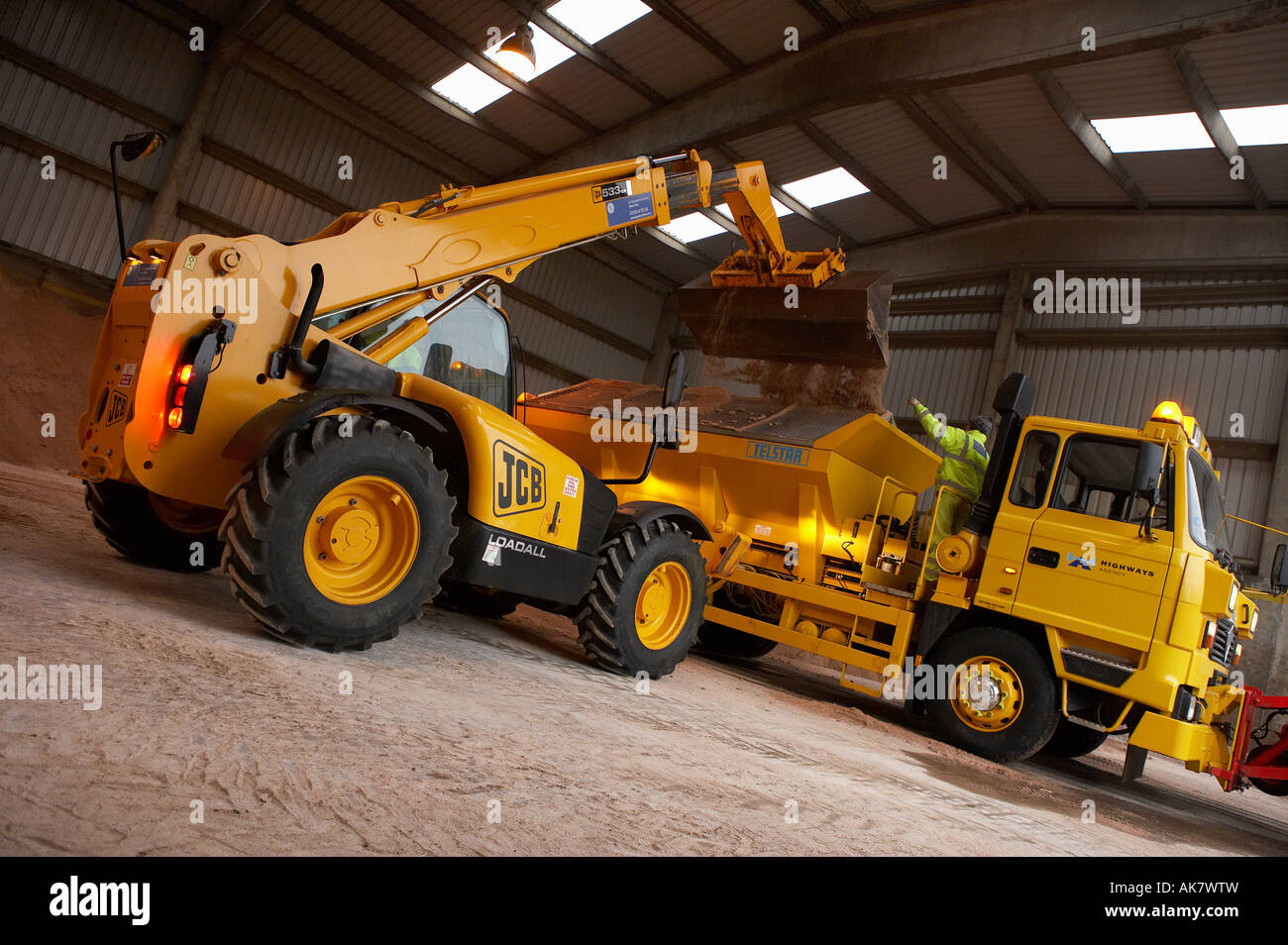 HIGHWAYS AGENCY GRITTING SNOW PLOUGH TRUCK LOADING WITH GRIT SAND AND ...