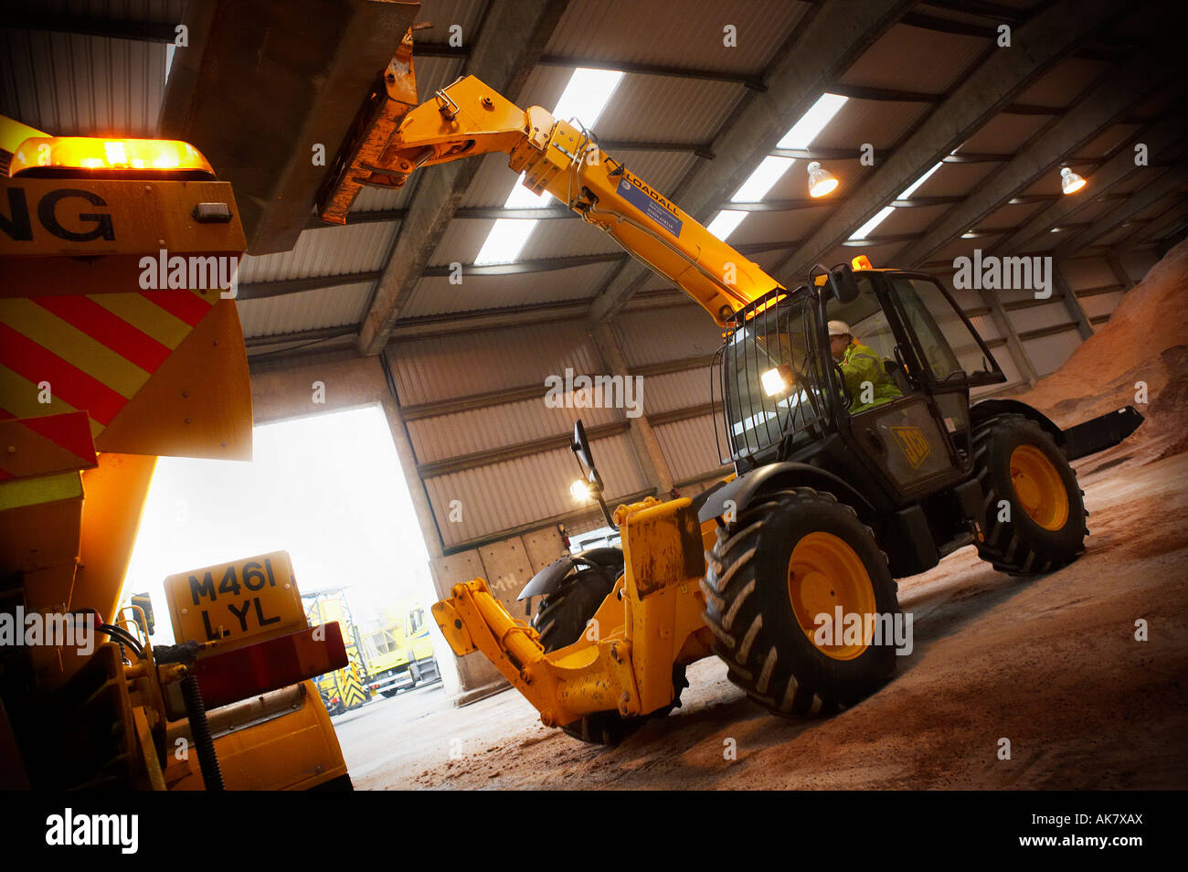 HIGHWAYS AGENCY GRITTING SNOW PLOUGH TRUCK LOADING WITH GRIT SAND AND ...