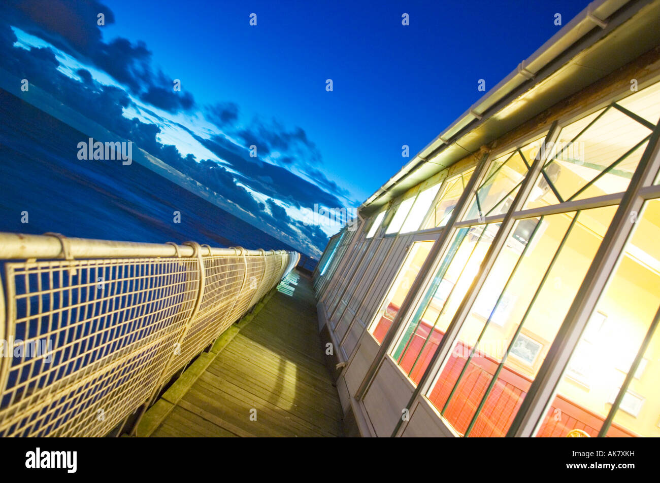 End of pier at dusk Stock Photo - Alamy