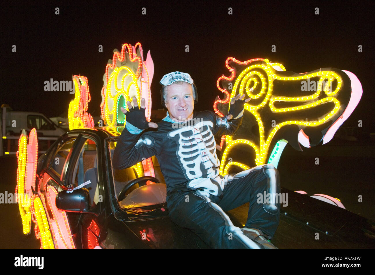Man in skeleton costume taking part in the Art car parade along ...
