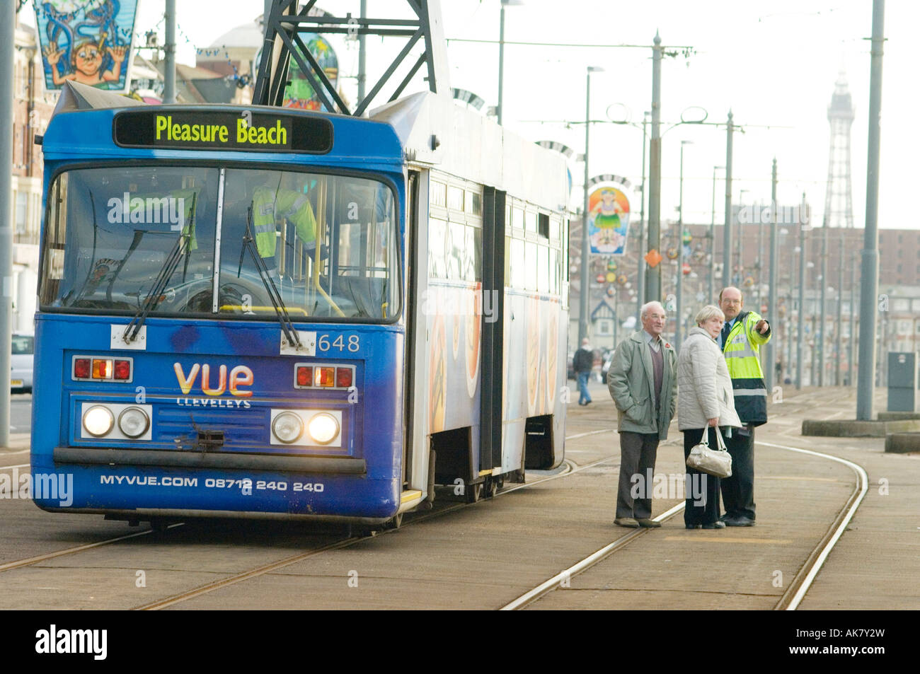 Tram driver giving directions to tourists in Blackpool,UK Stock Photo ...