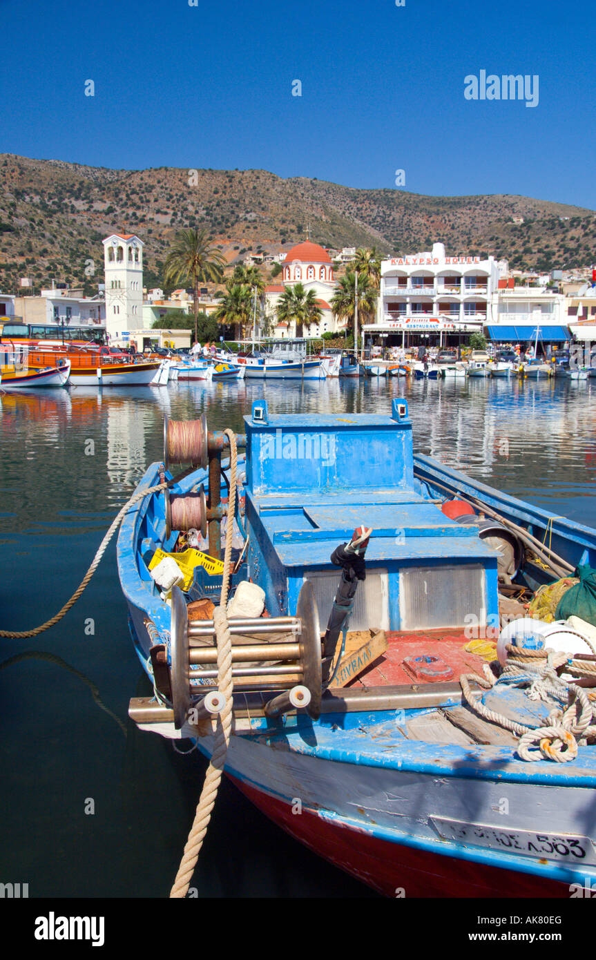 Colorful fishing boats in the harbour of the seaside village of Elounda ...