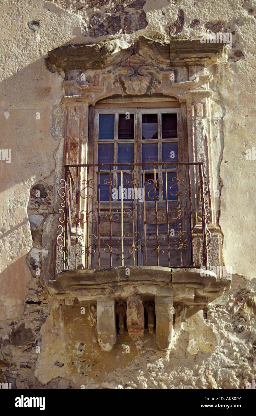 Old decaying window and balcony on facade of the Casa de Moneda or old ...