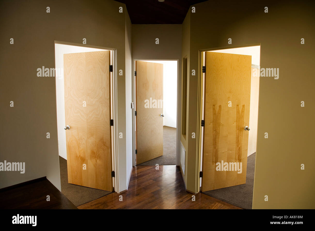 Three Open Doors in Modern Hallway Stock Photo - Alamy