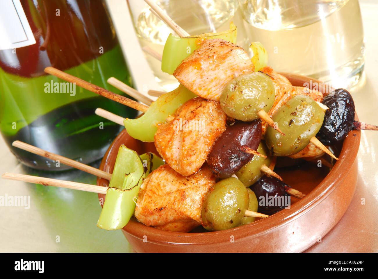 Spanish-style tapas of chicken, olive and pepper pinchitos in ...