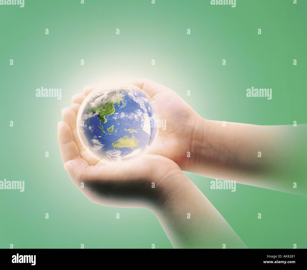 Hand holding earth Stock Photo - Alamy