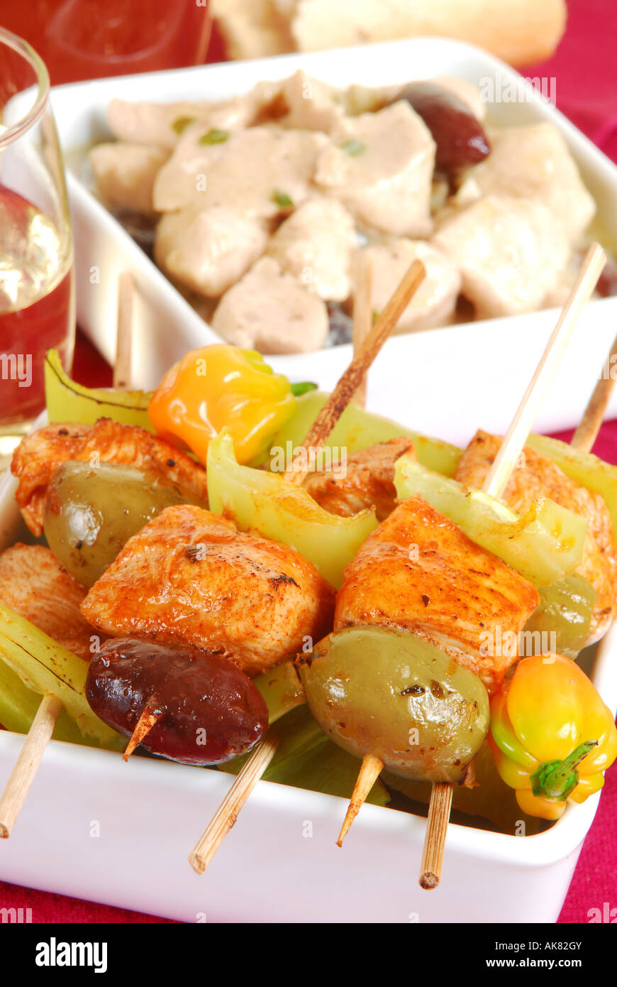 Spanish-style tapas of chicken, olive and pepper pinchitos, with ...