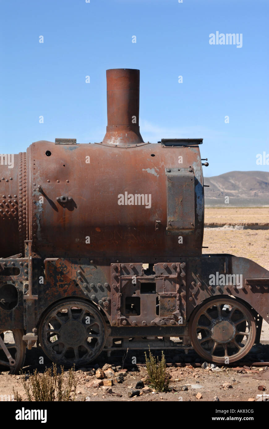 An old, rusty train sits in a train graveyard outside of Uyuni, Bolivia ...