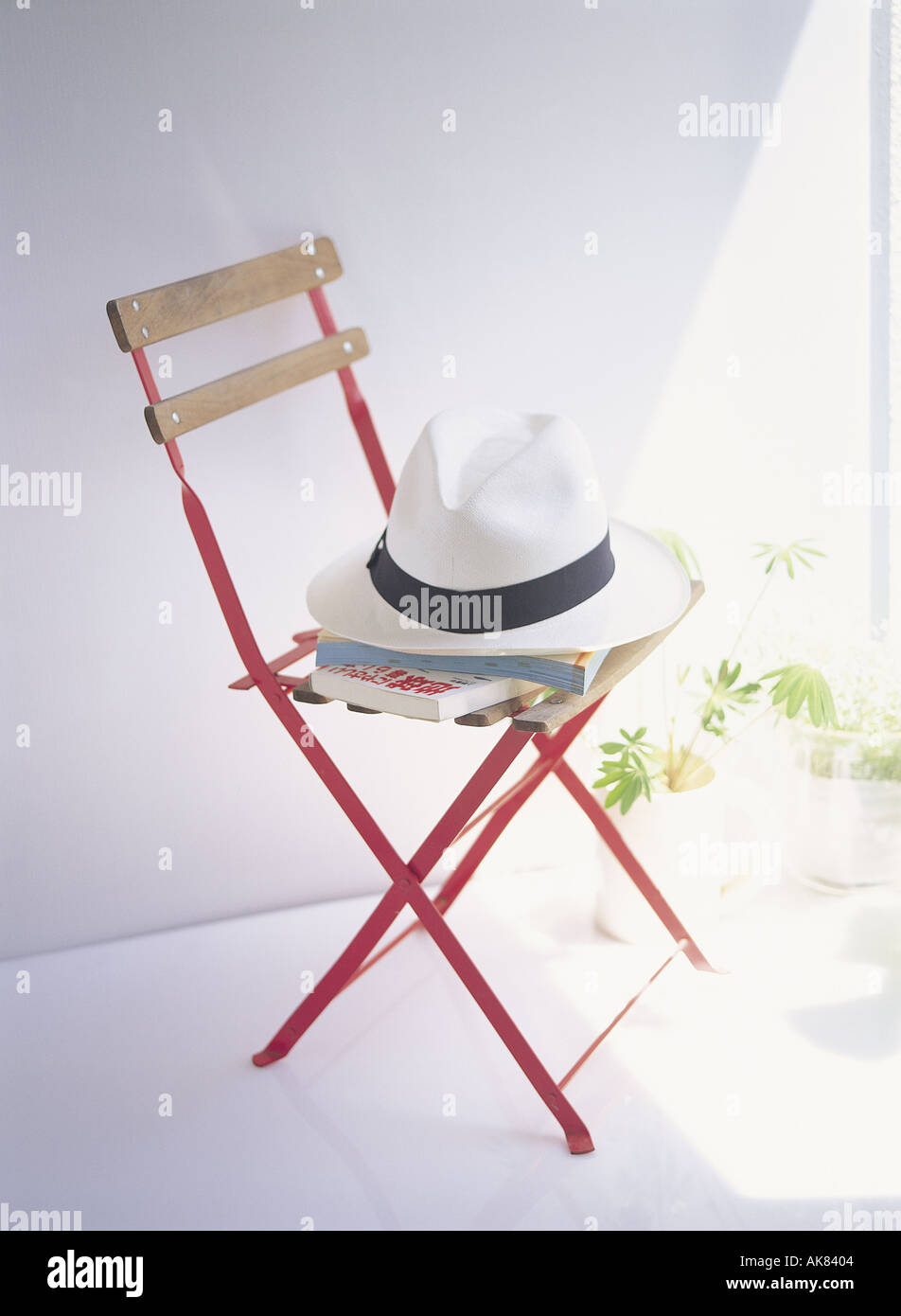 Hat on chair Stock Photo - Alamy