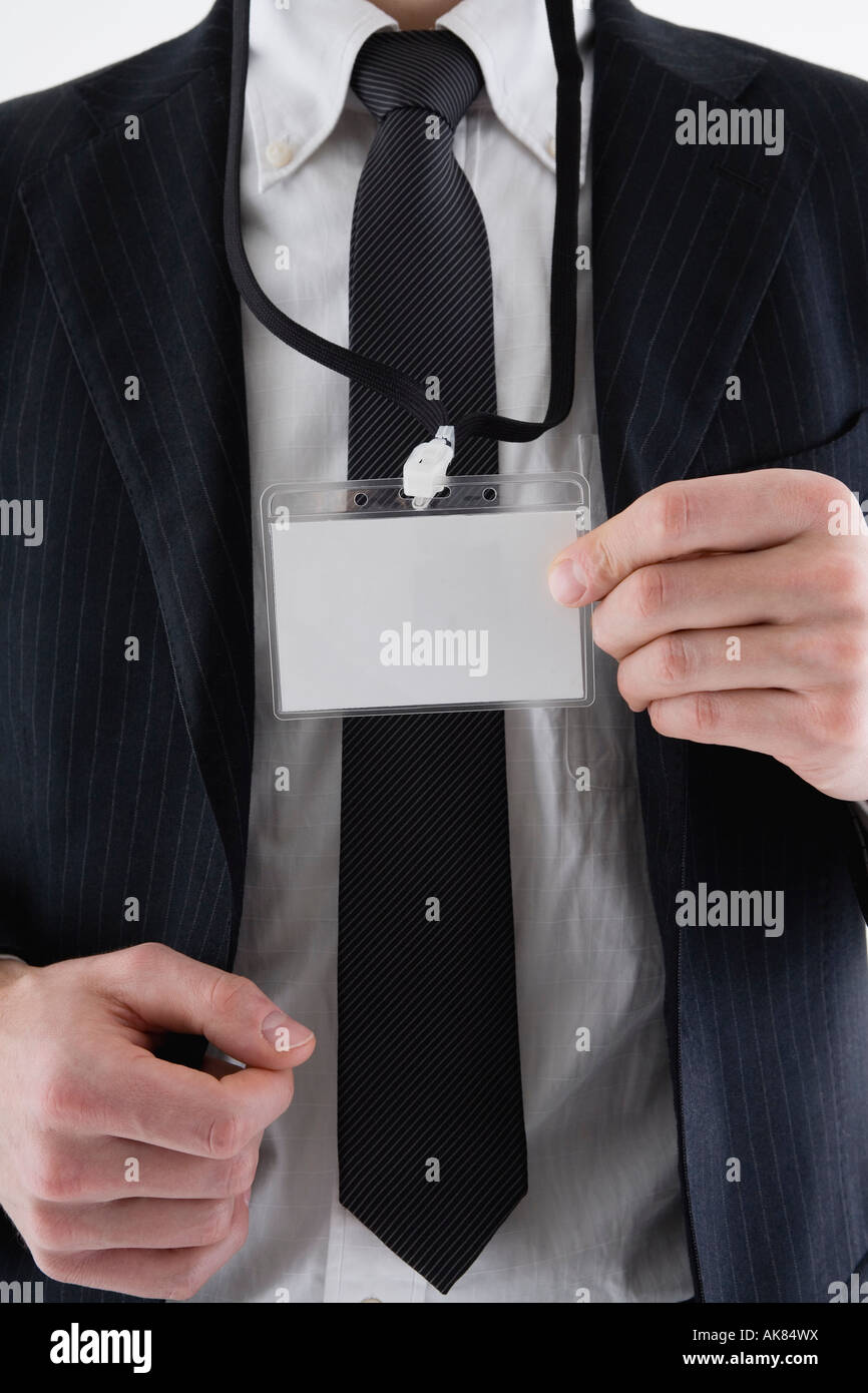 Businessman wearing ID card Stock Photo - Alamy