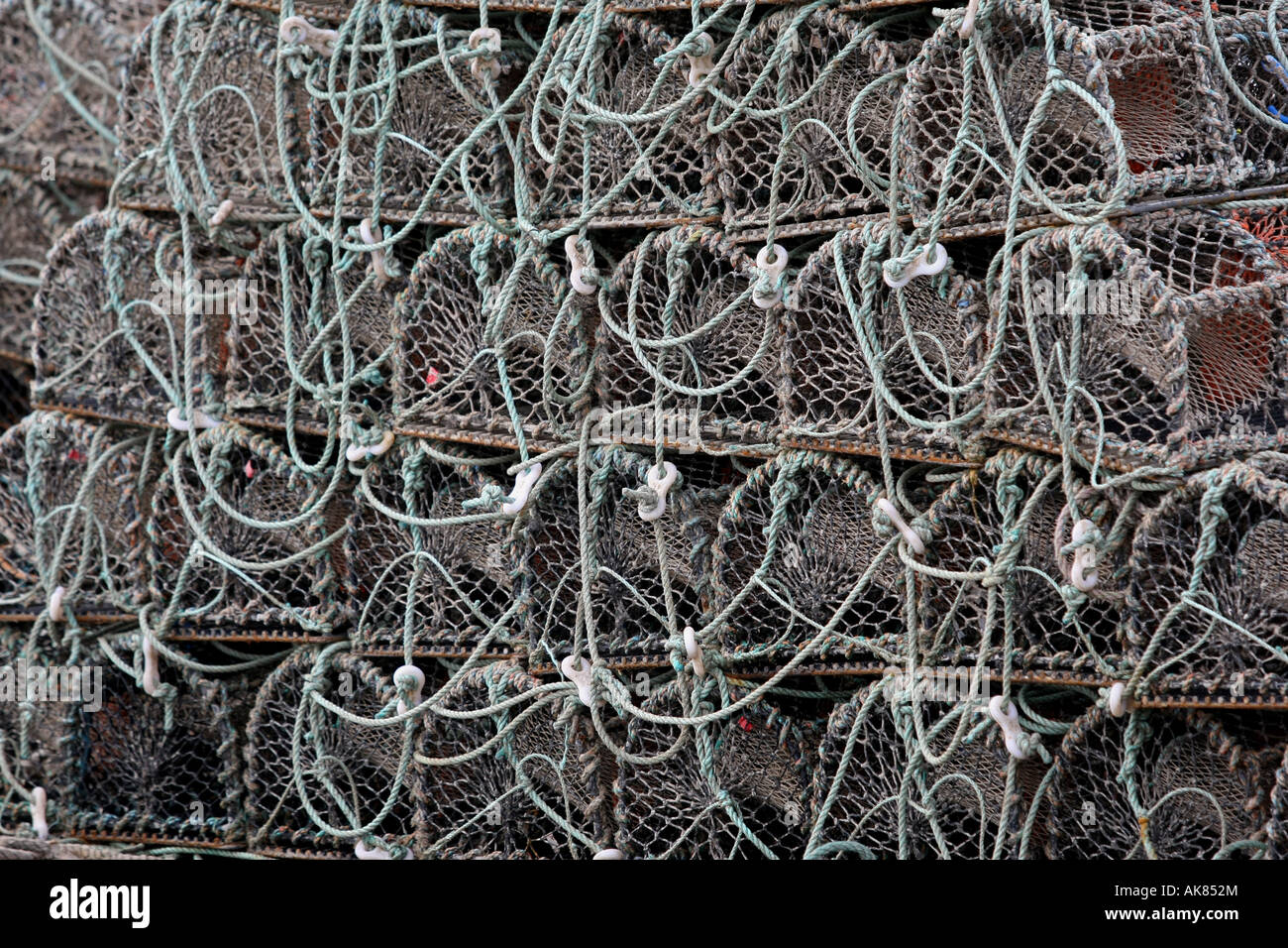 Fishing creels stacked on a harbour wall Stock Photo - Alamy