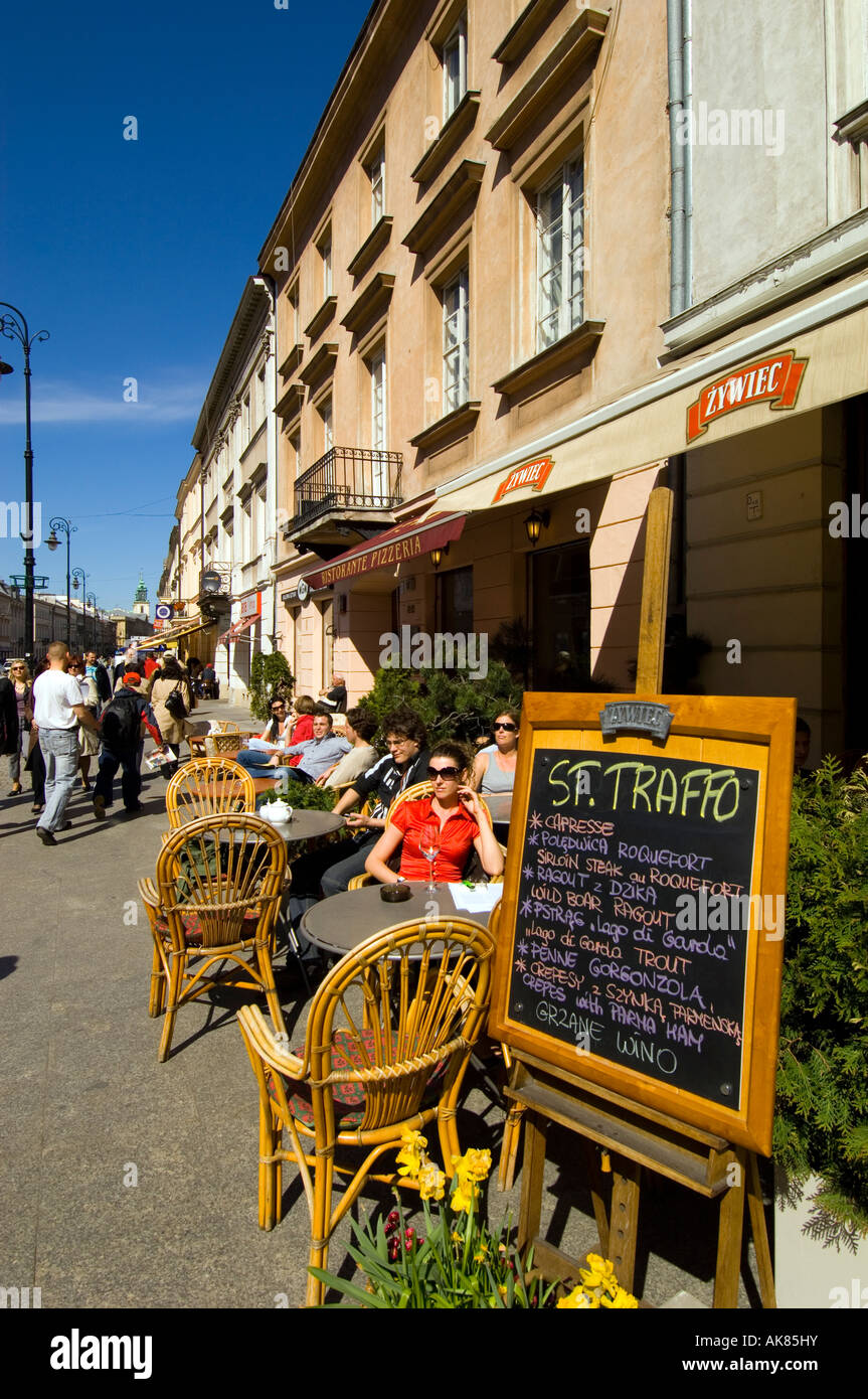 People enjoying a drink in a cafe bar on ulica Nowy Swiat Warsaw Poland ...