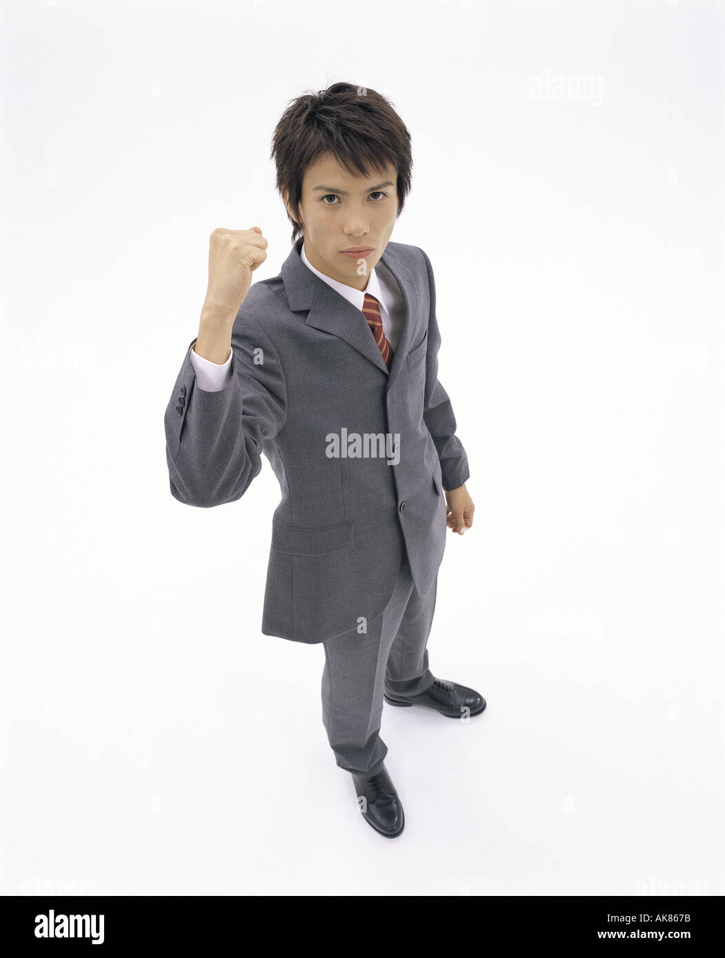 Businessman with victory pose Stock Photo - Alamy