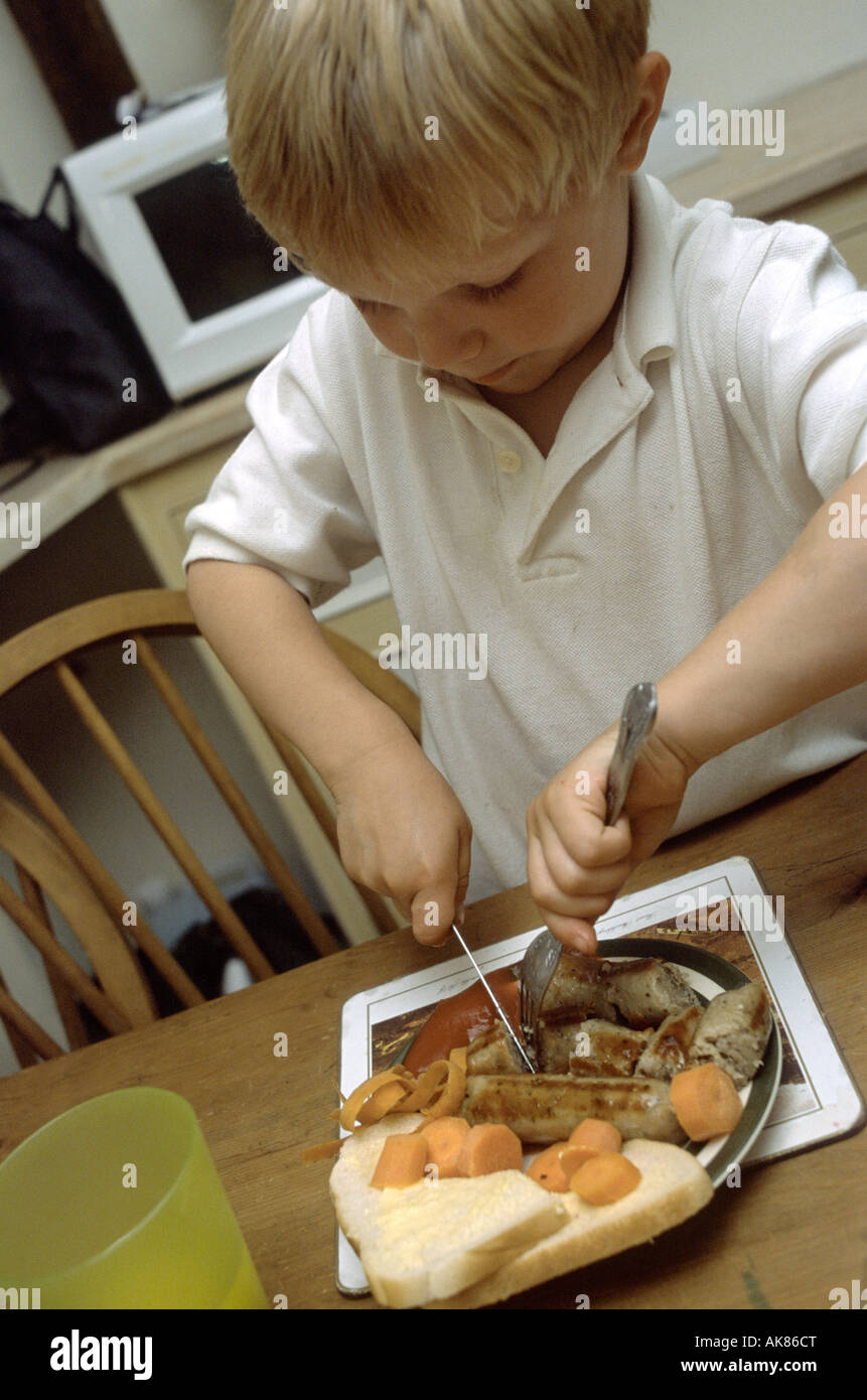Using a fork and knife hi-res stock photography and images - Alamy