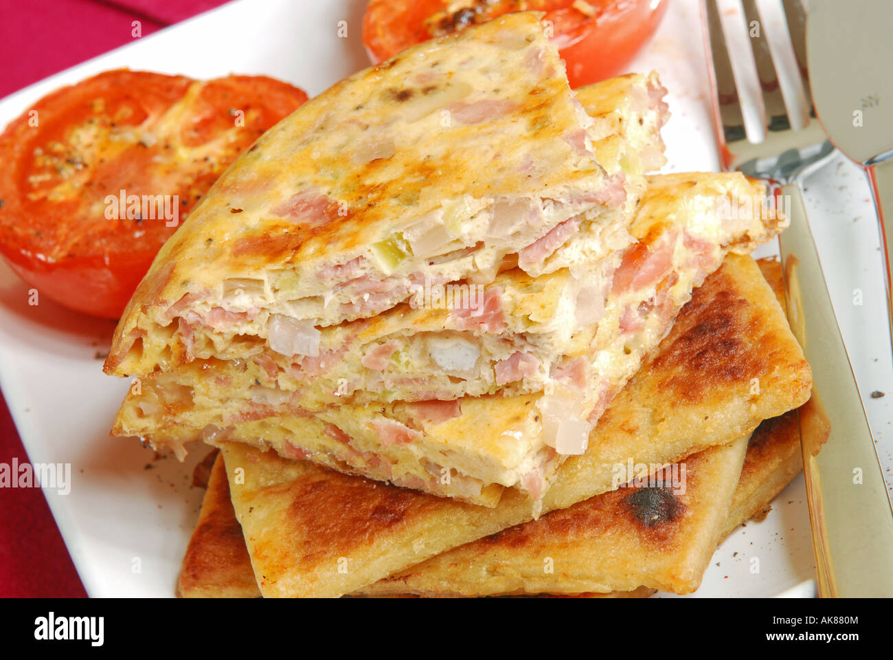 Breakfast of cheese and bacon omelette slices on Irish farls (potato ...