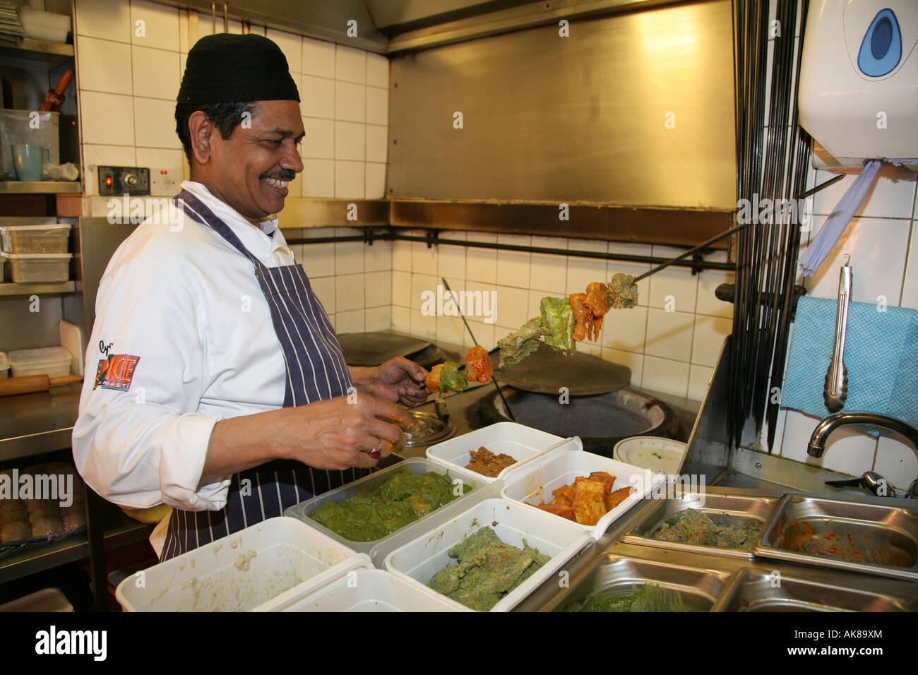 A cook prepares a kebab in a restaurant kitchen Stock Photo - Alamy