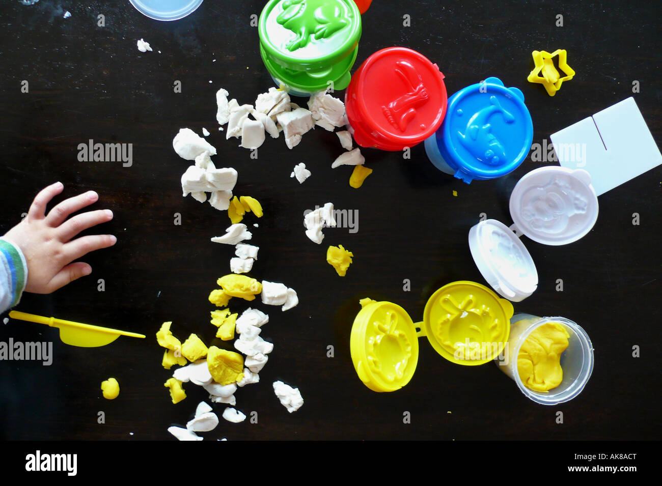 small boy playing with modeling clay Stock Photo - Alamy